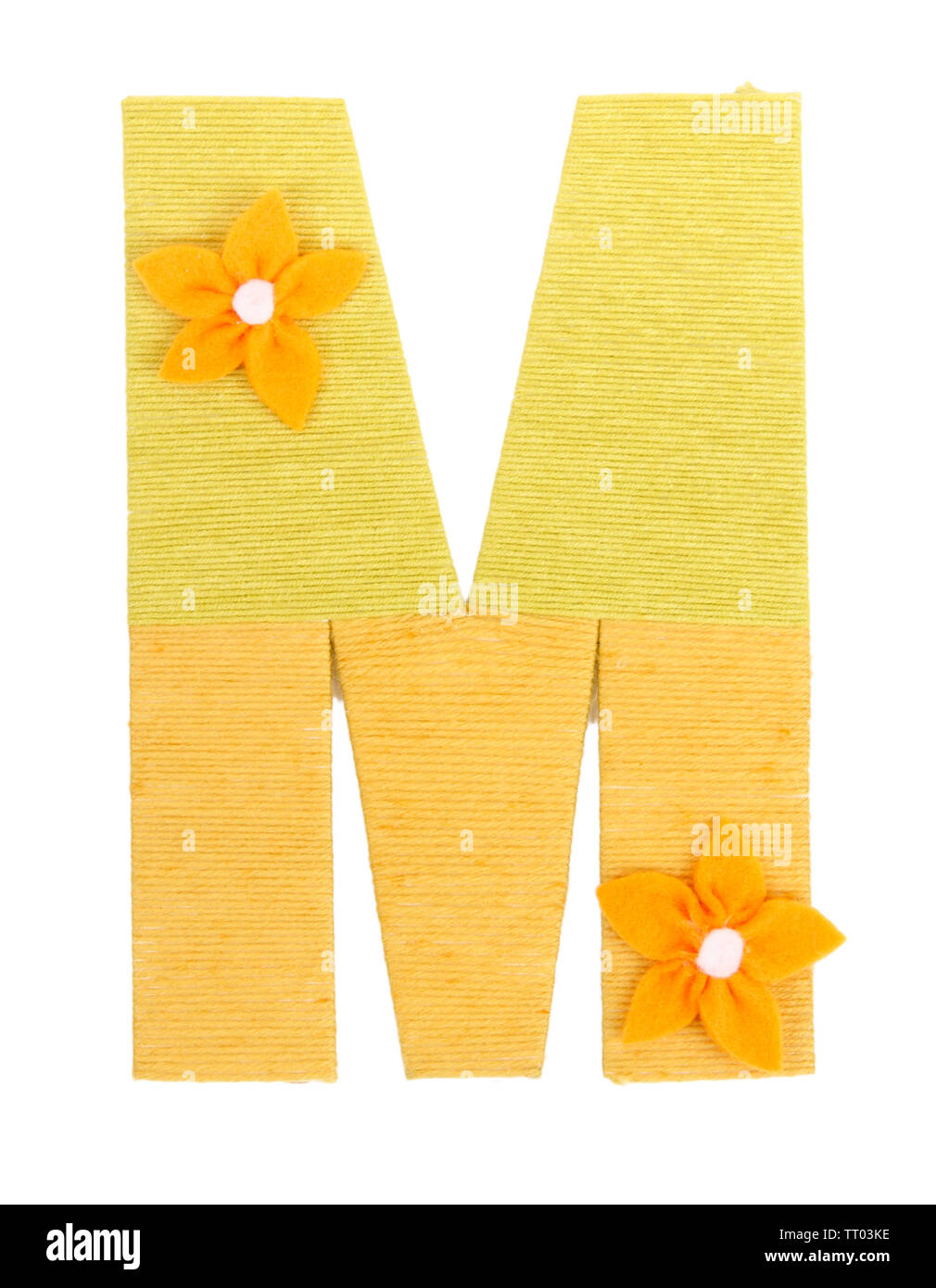 Letter M created with brightly colored knitting yard isolated on white ...