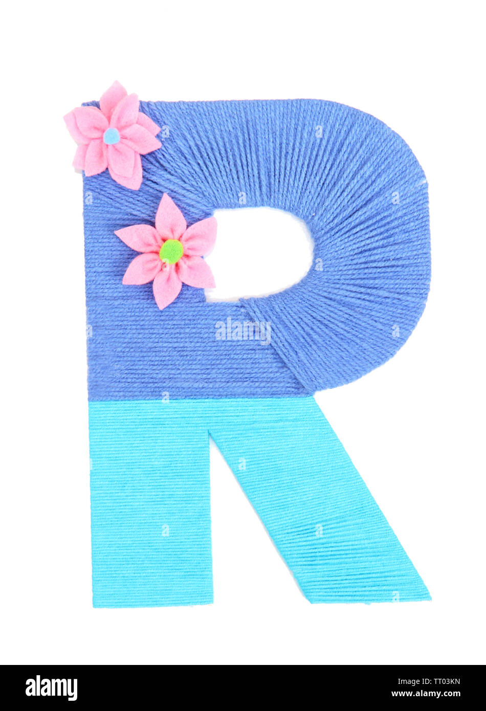 Letter R created with brightly colored knitting yard isolated on white ...