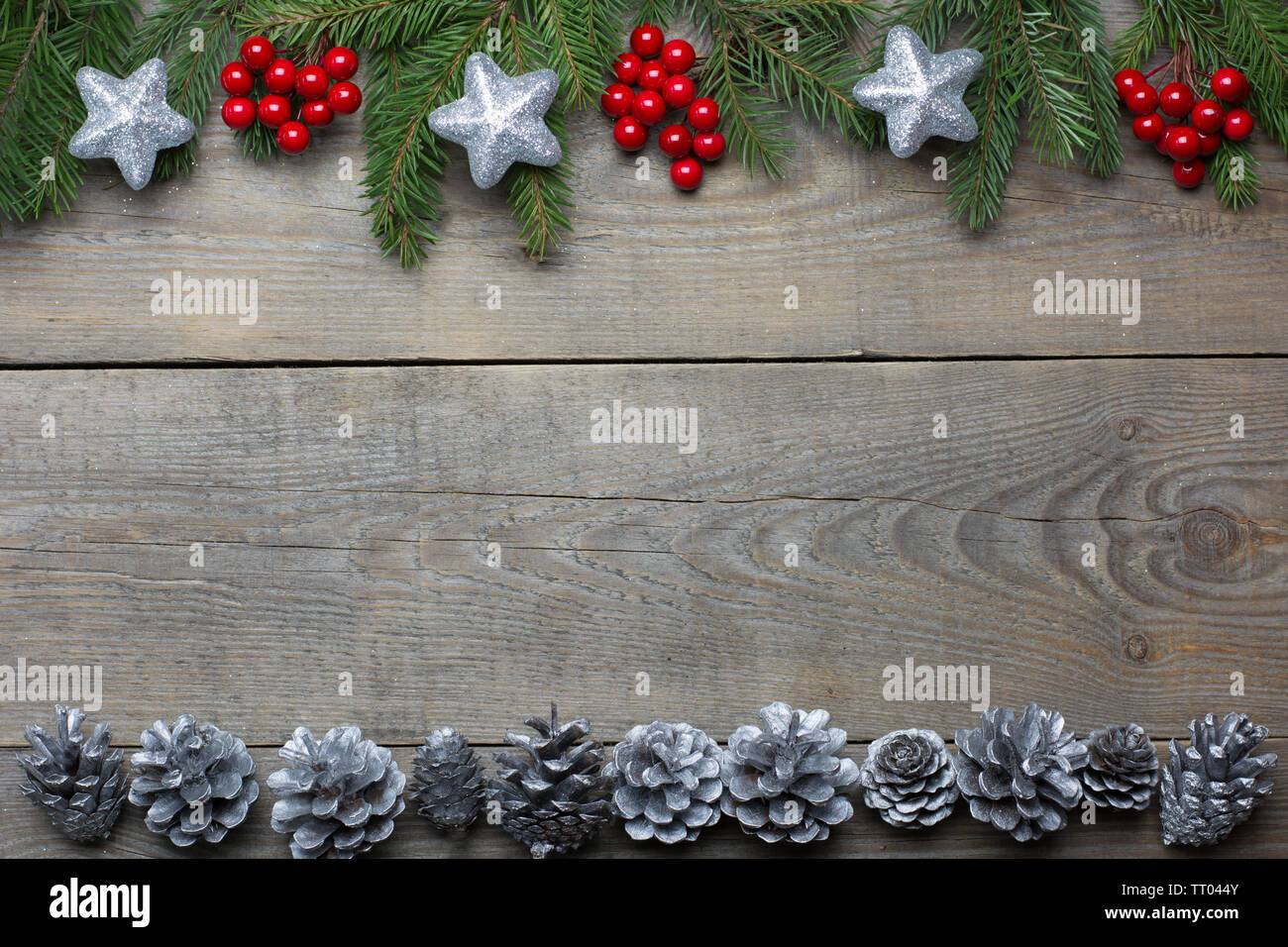Christmas card concept with fir tree branches, rowan berries, silver ...