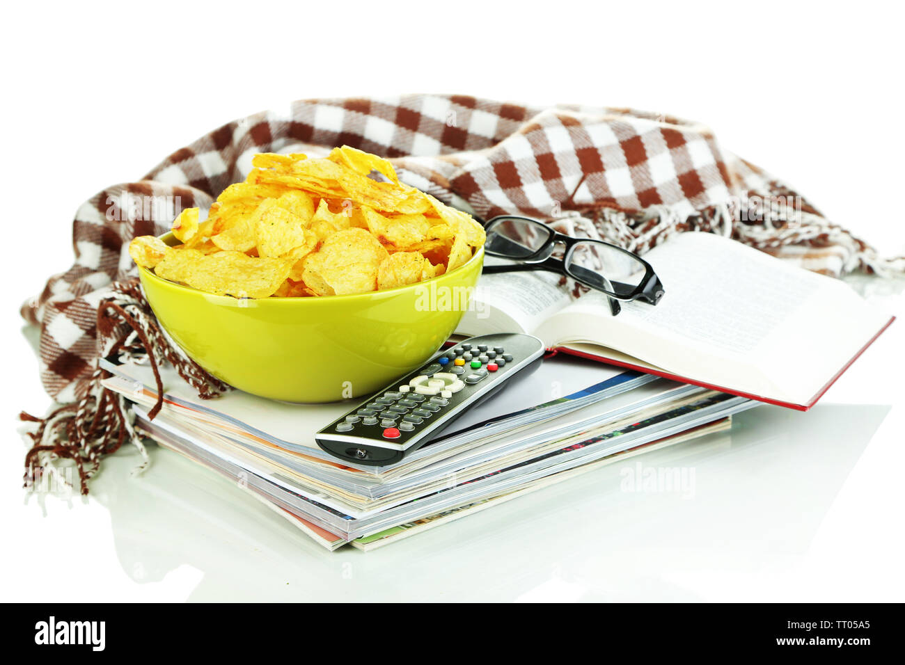 Chips in bowl and TV remote isolated on white Stock Photo - Alamy