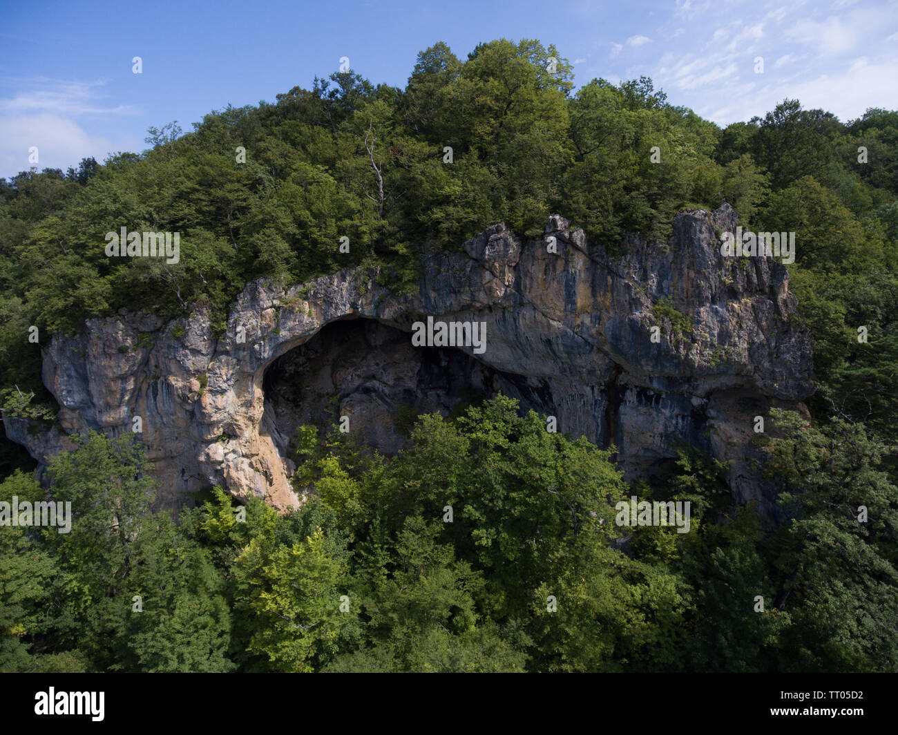 Aerial Photos. The cave entrance is emblazoned on the side of a ...