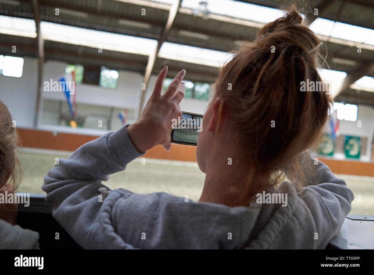 Kids learning horse riding and dressage at a horse riding school in ...