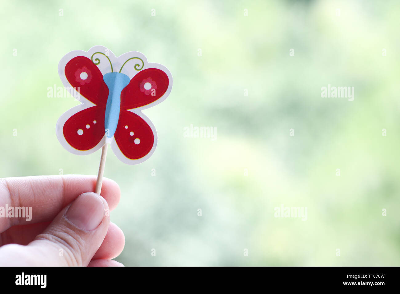 Hand blue butterfly hi-res stock photography and images - Alamy