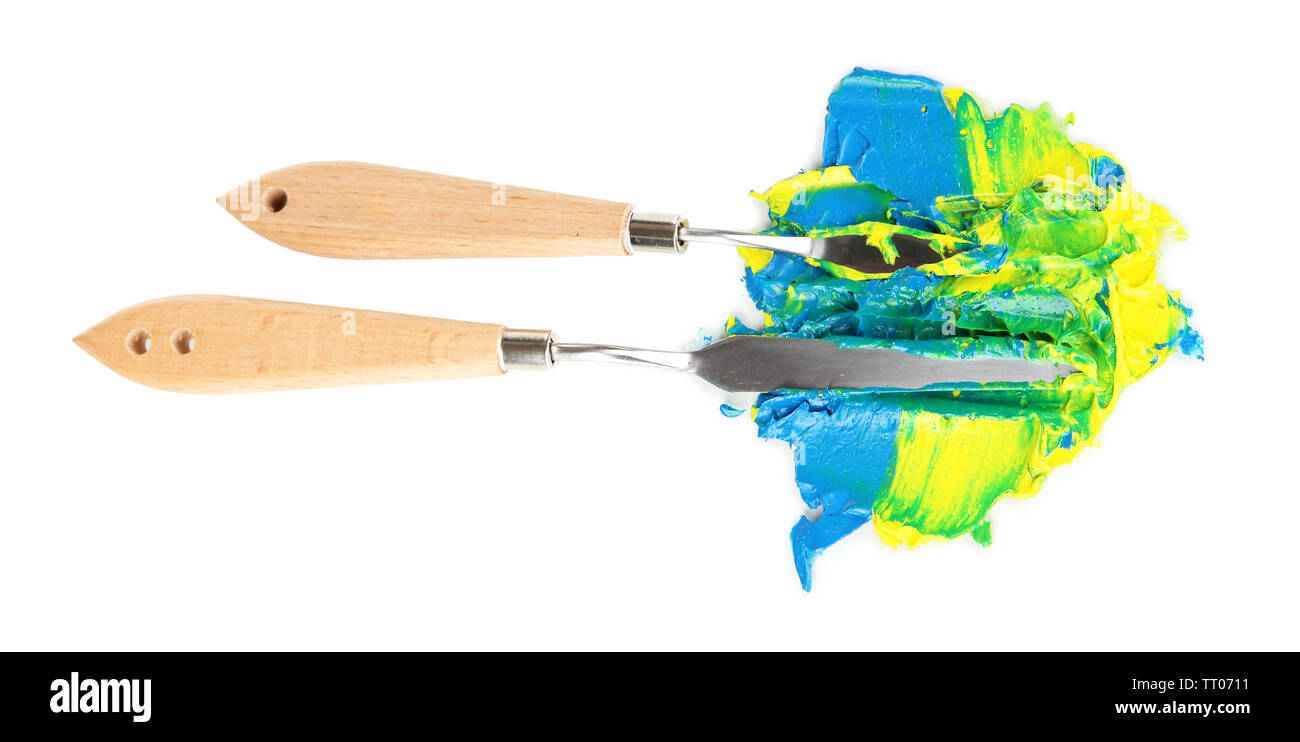 Painting palette knifes with paint isolated on white Stock Photo - Alamy