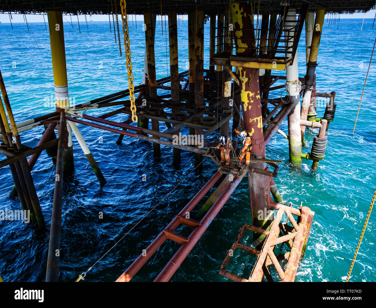 Rope access decomisining of oil and gas platform Stock Photo - Alamy