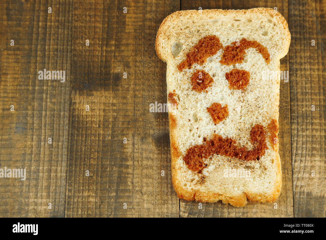 Funny toast, on wooden background Stock Photo - Alamy