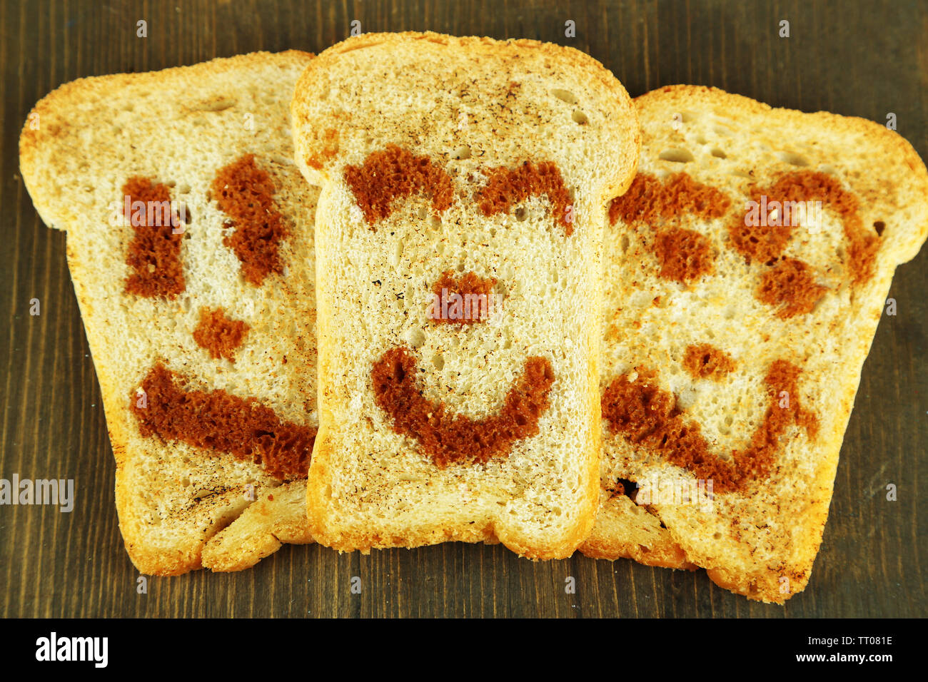 Funny toasts, on wooden background Stock Photo - Alamy