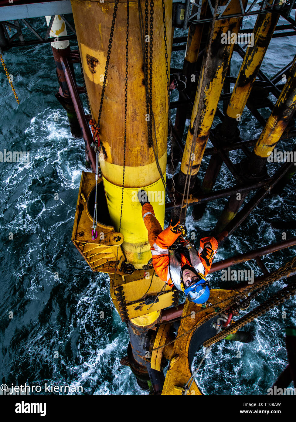 Rope access decomisining of oil and gas platform Stock Photo - Alamy