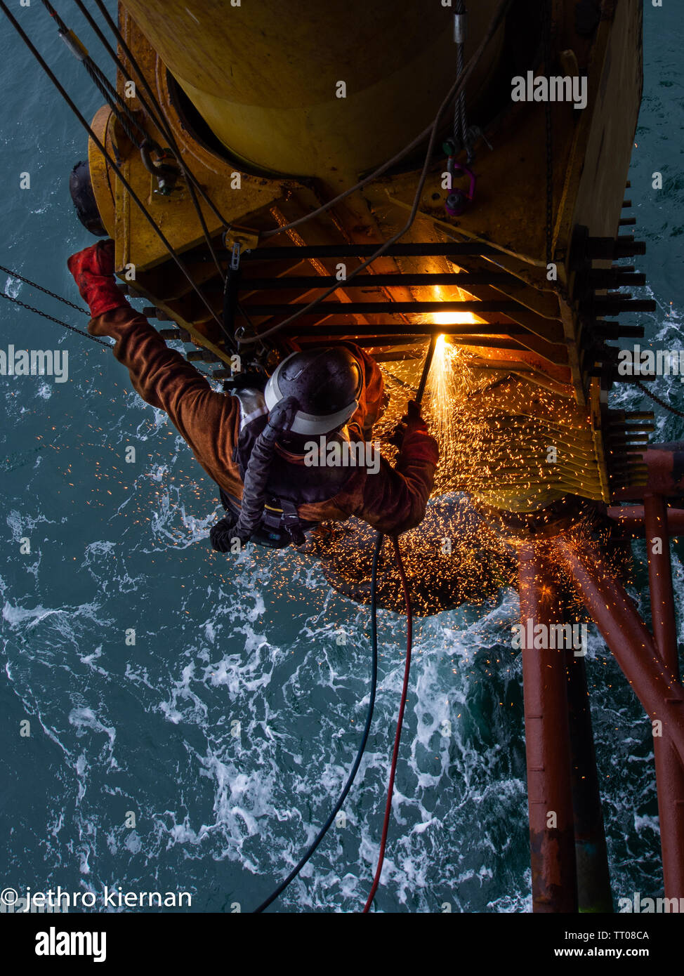 Rope access decomisining of oil and gas platform Stock Photo - Alamy
