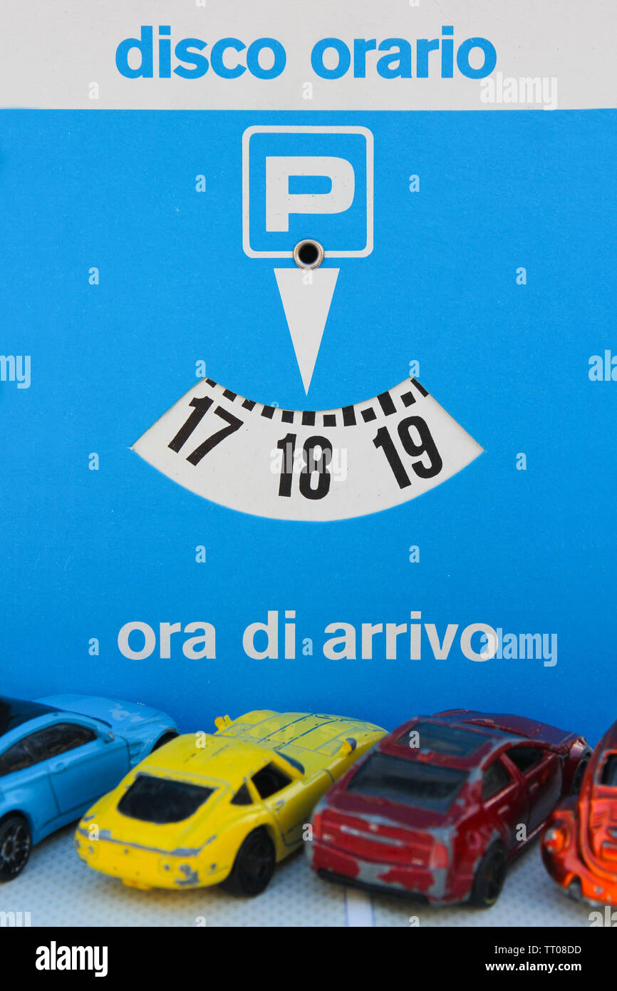 Disc parking and cars parked in a row Stock Photo - Alamy