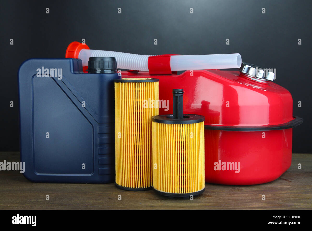 Diesel and oil canisters on grey background Stock Photo - Alamy