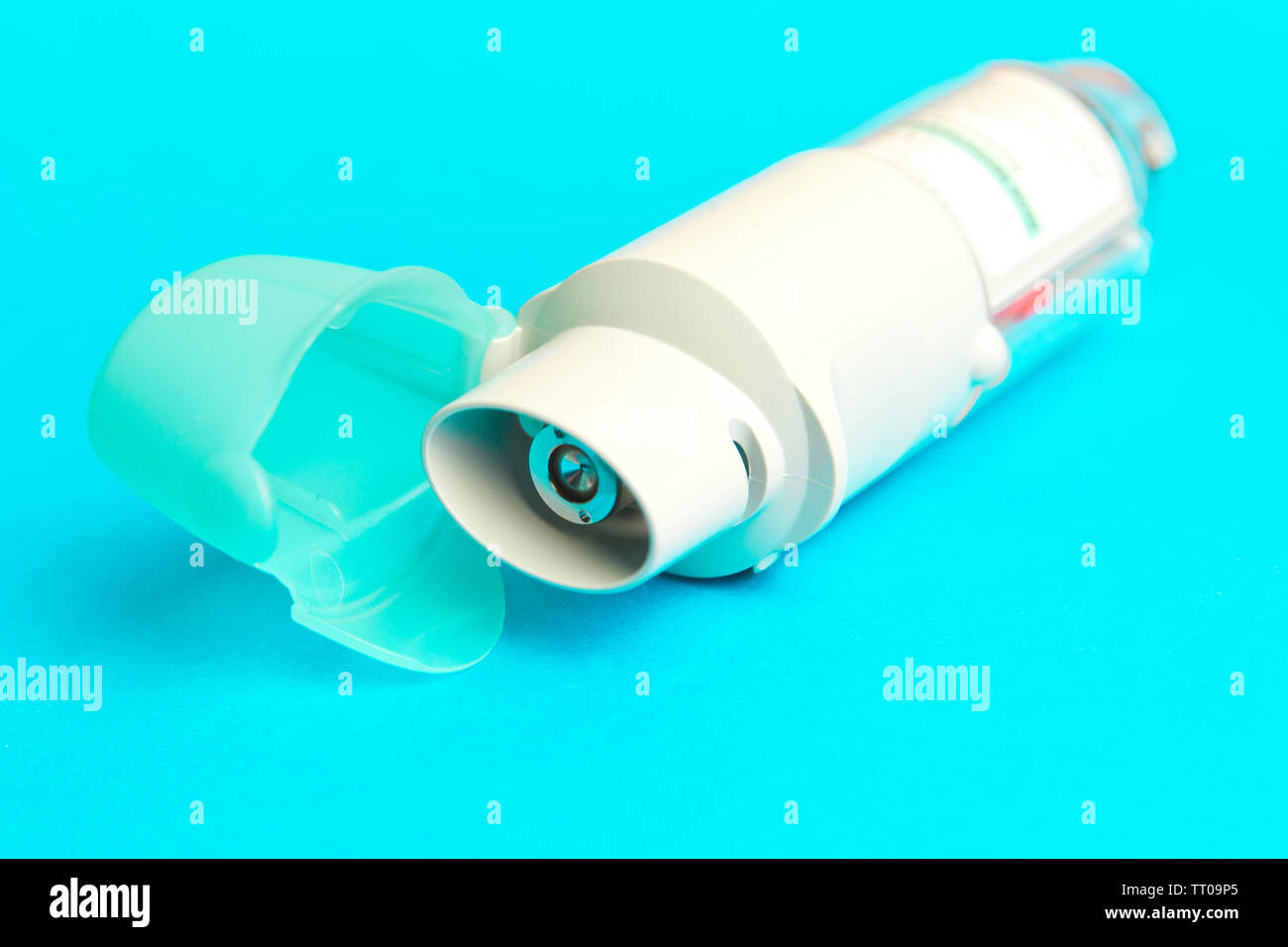 inhaler against asthma on blue background Stock Photo - Alamy