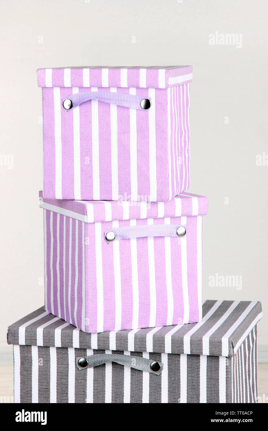 Textile boxes in room Stock Photo - Alamy