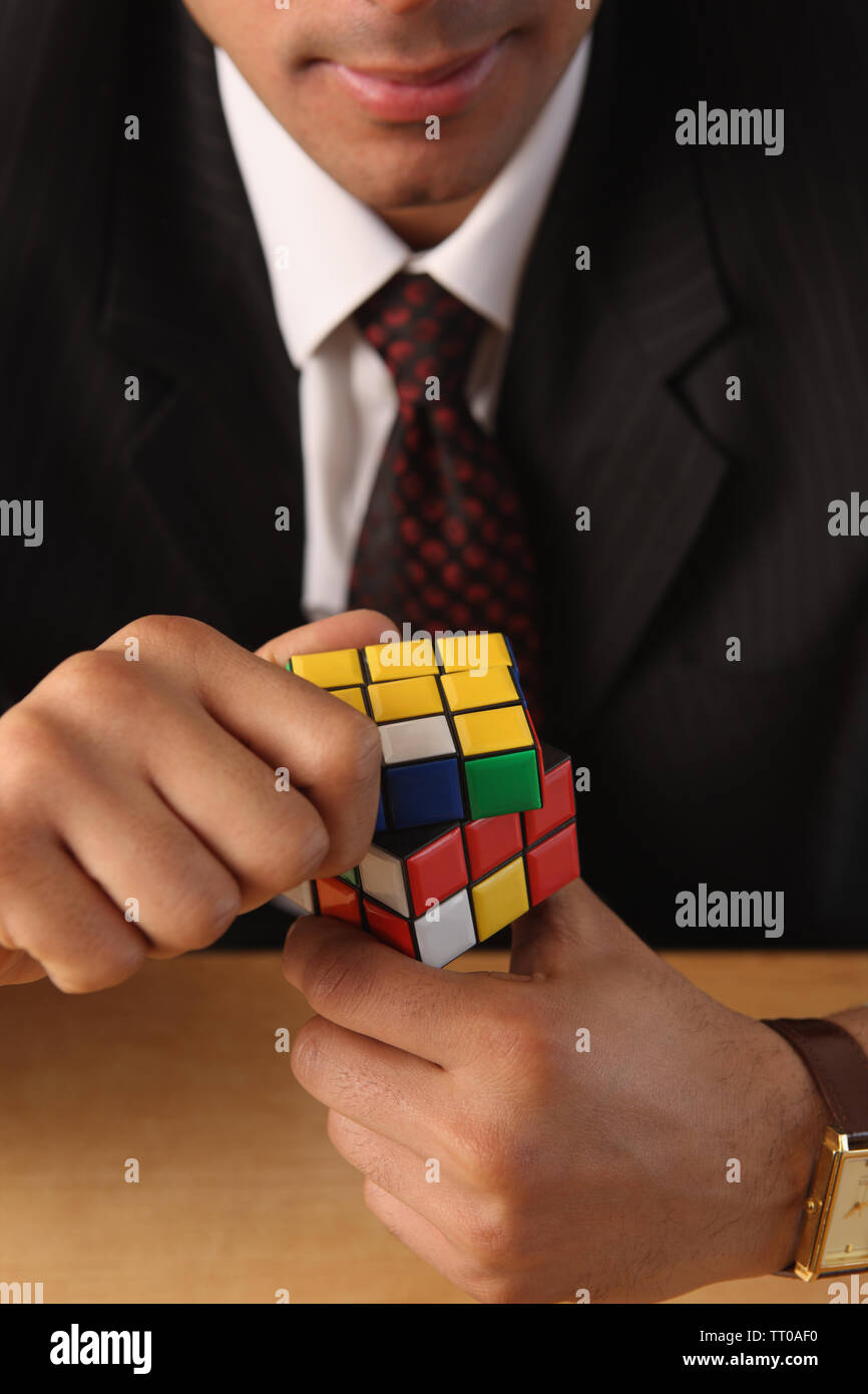Man with rubik cube hi-res stock photography and images - Alamy
