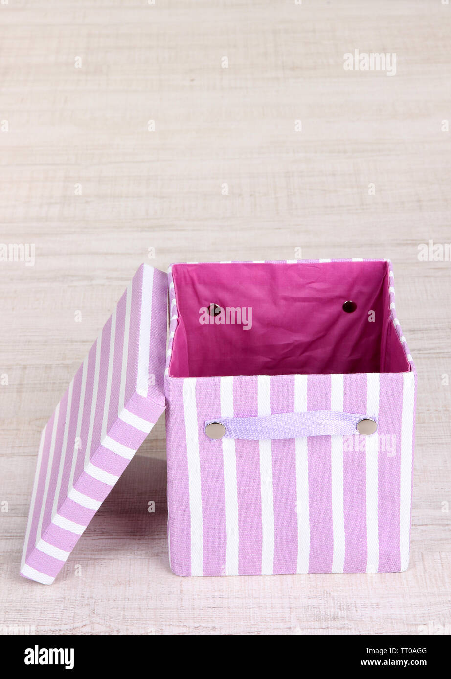 Textile box on floor in room Stock Photo - Alamy