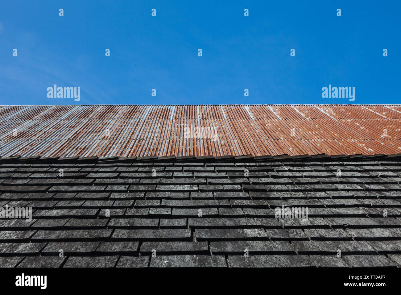 Comparison of roofing materials on two adjacent buildings on the ...