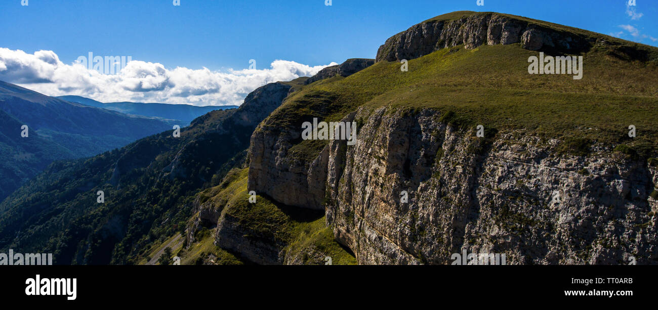 Panoramic view of the steep wall of rock Stock Photo - Alamy