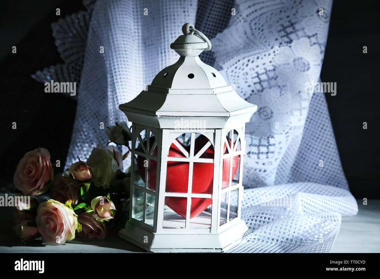 Heart in cage on dark background Stock Photo - Alamy