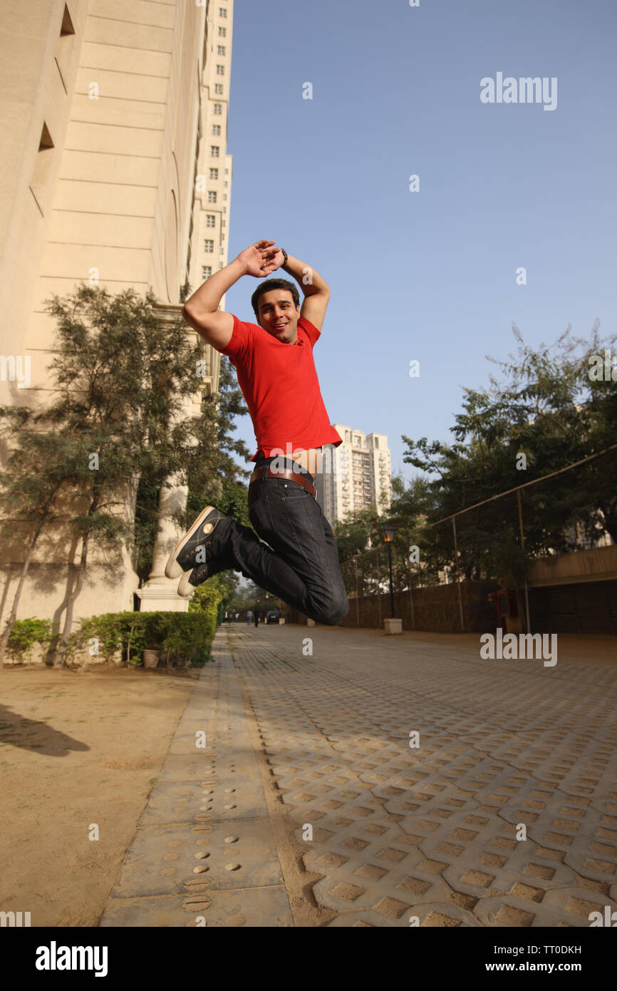 Side profile of a man jumping Stock Photo - Alamy