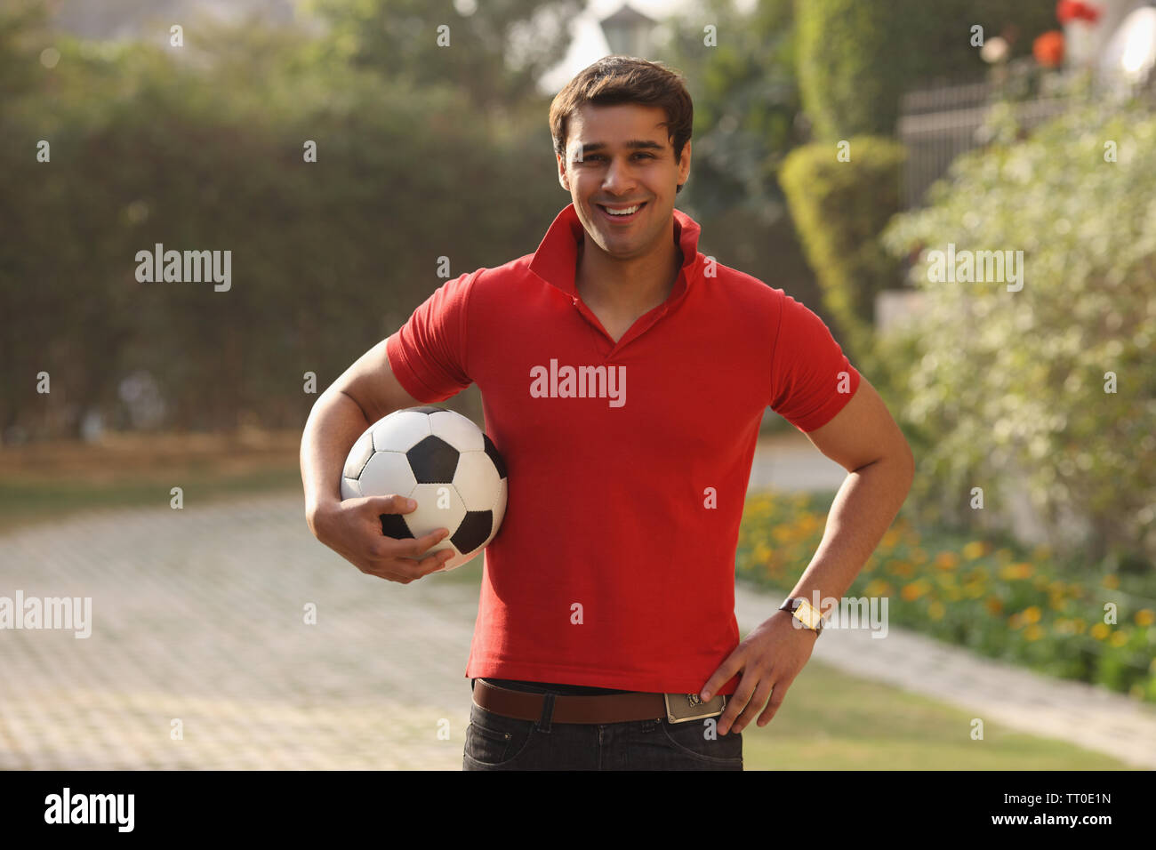 Footballer back holding ball hi-res stock photography and images - Alamy