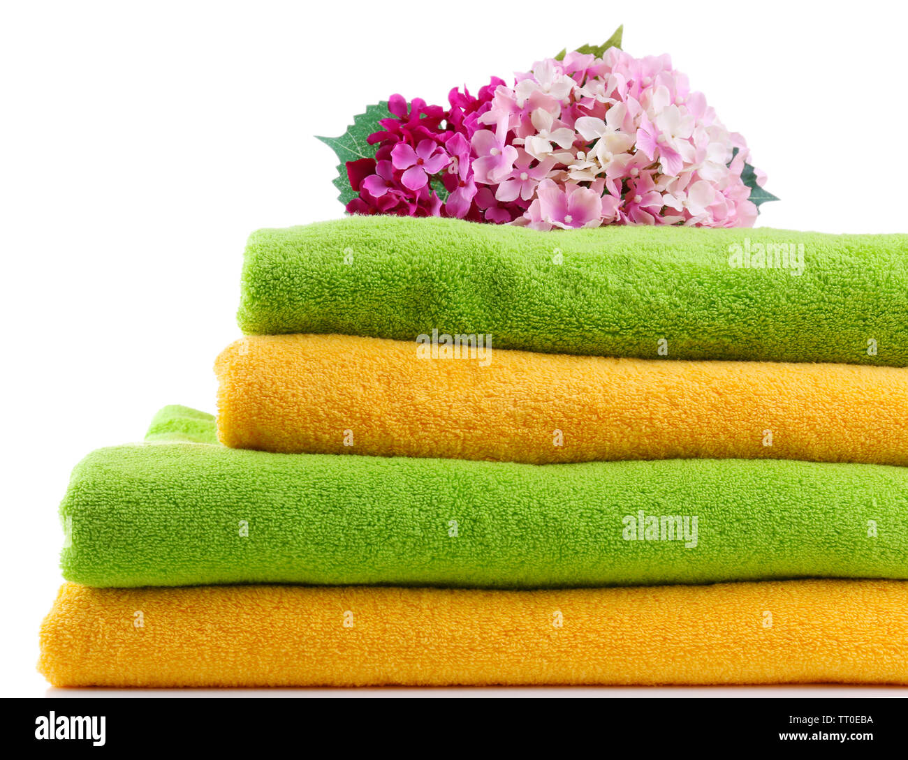 Colorful towels and flowers, isolated on white Stock Photo - Alamy