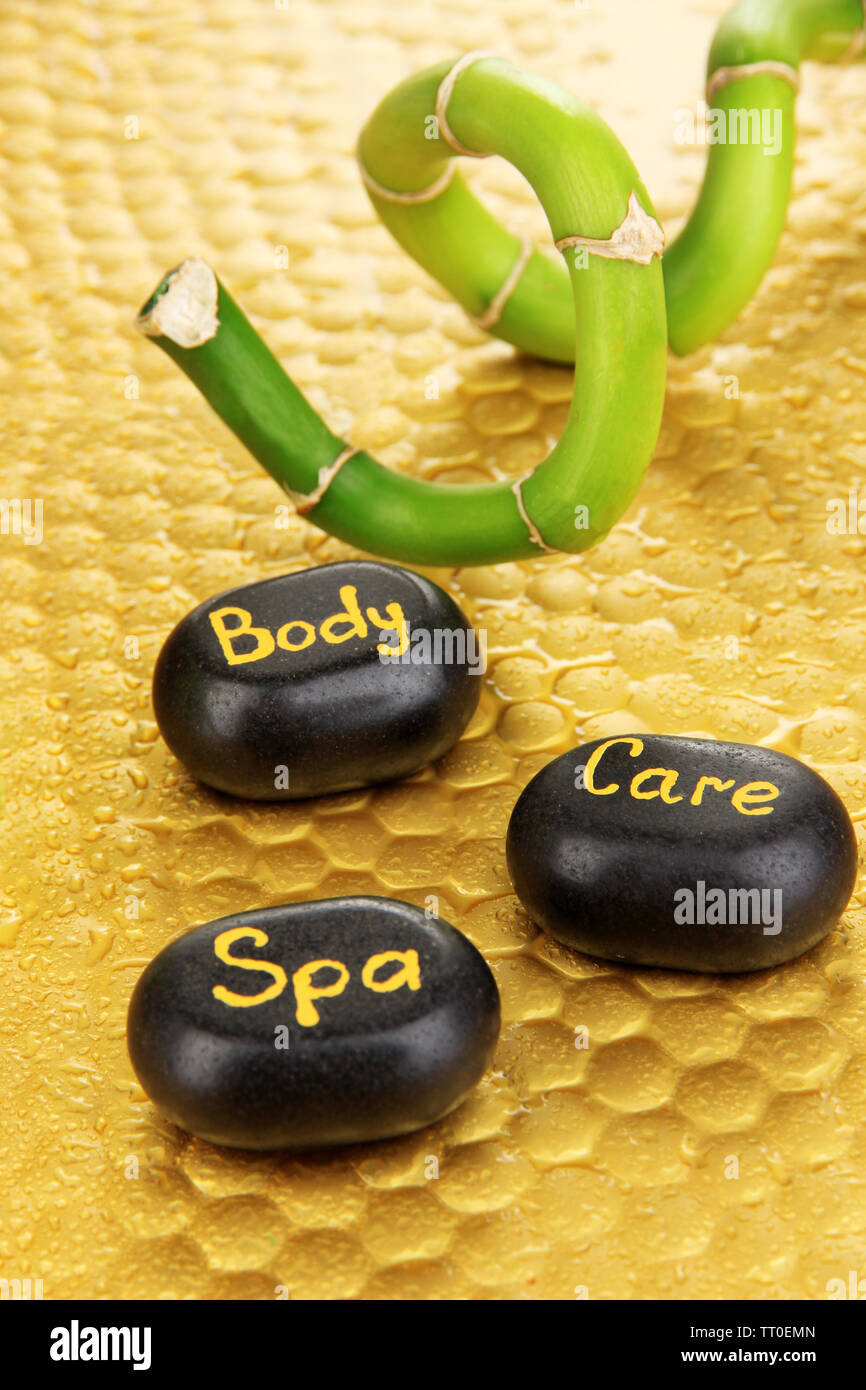 Spa stones on golden background Stock Photo - Alamy