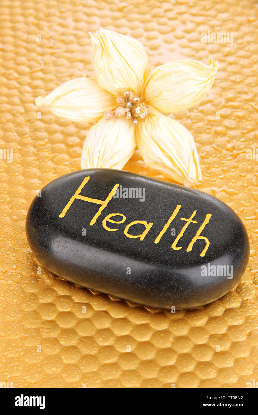 Spa stones on golden background Stock Photo - Alamy