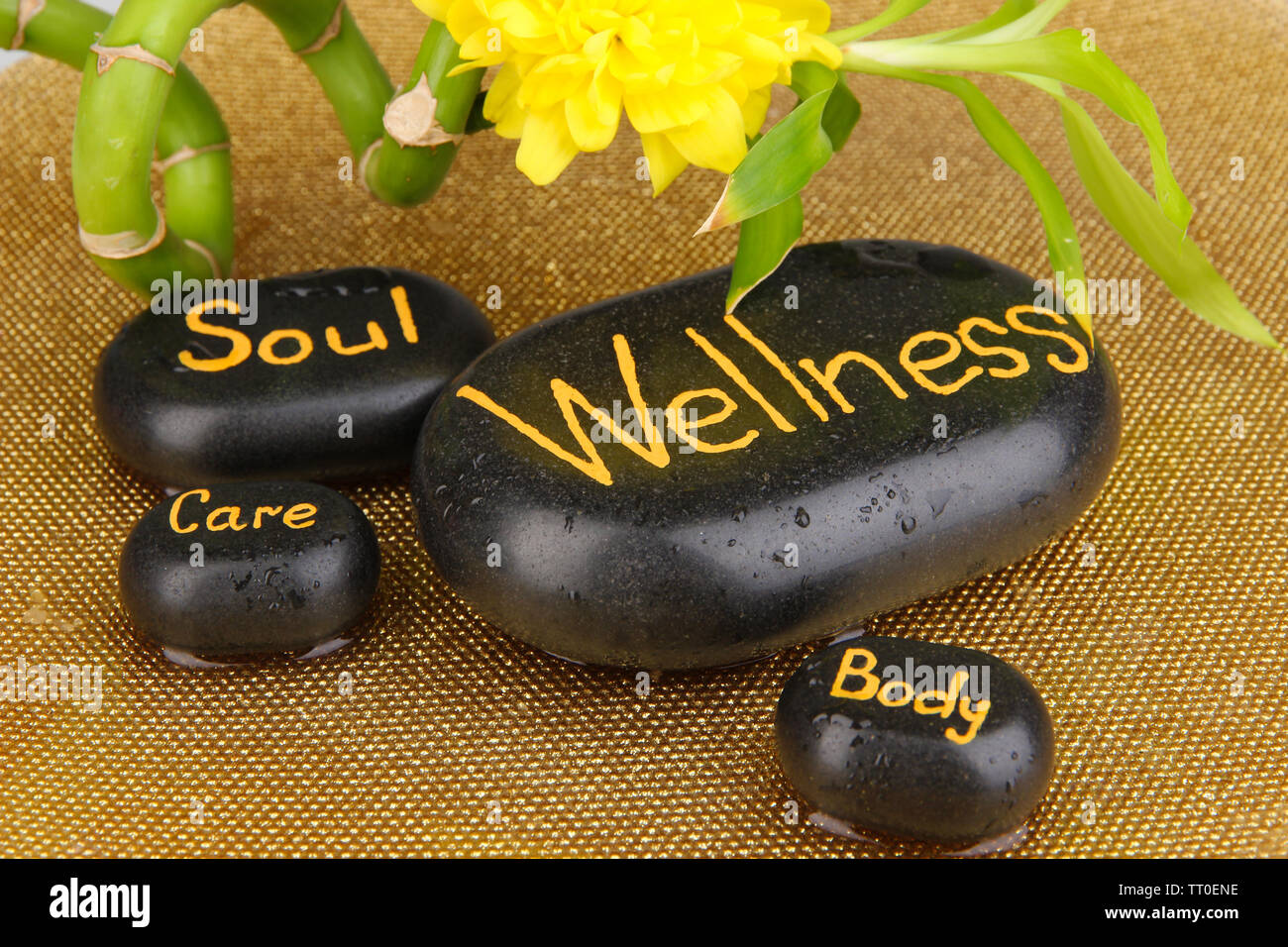 Spa stones on golden background Stock Photo - Alamy