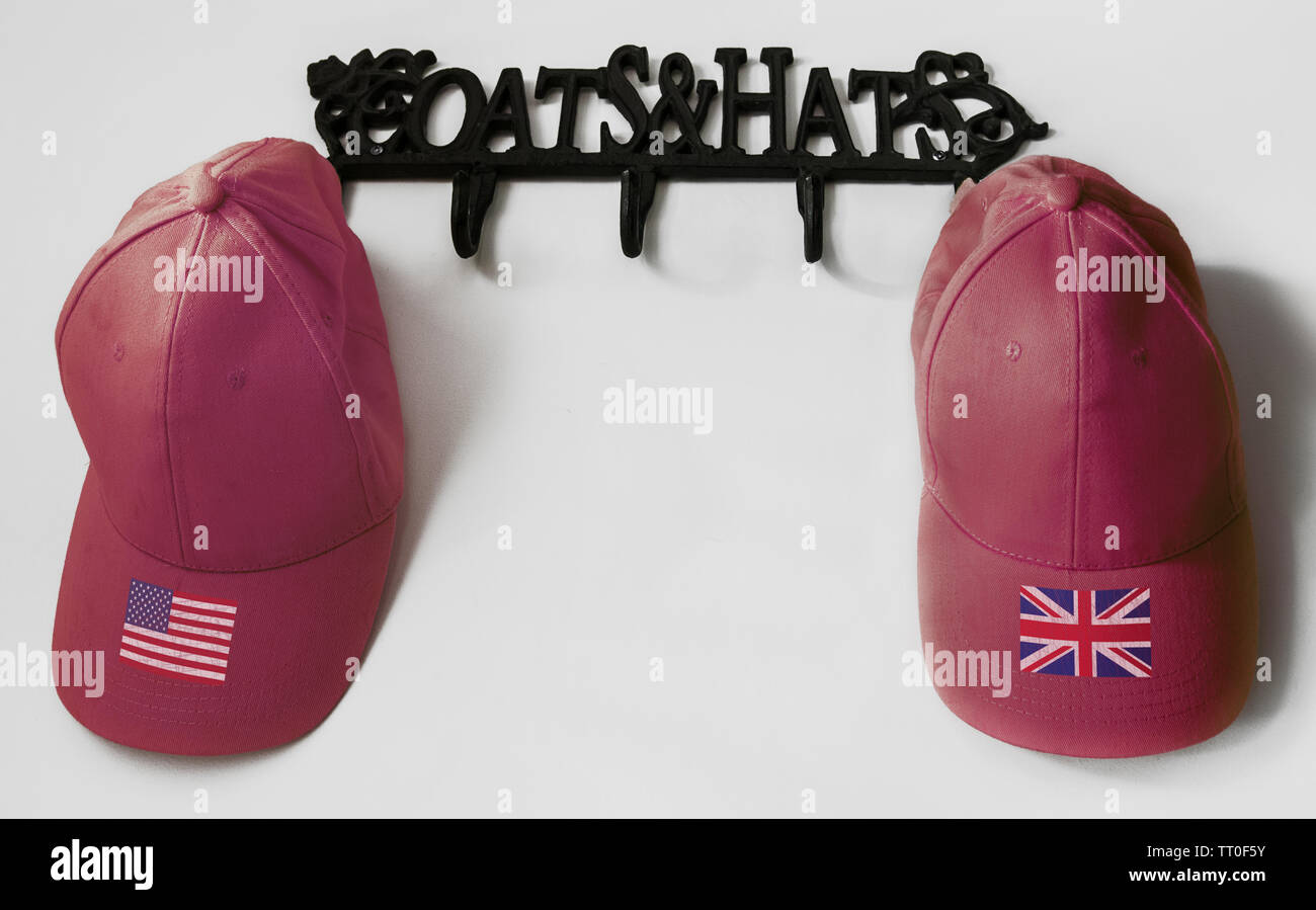 On the hooks, two red hats. One wearing the Us flag , the other one the ...