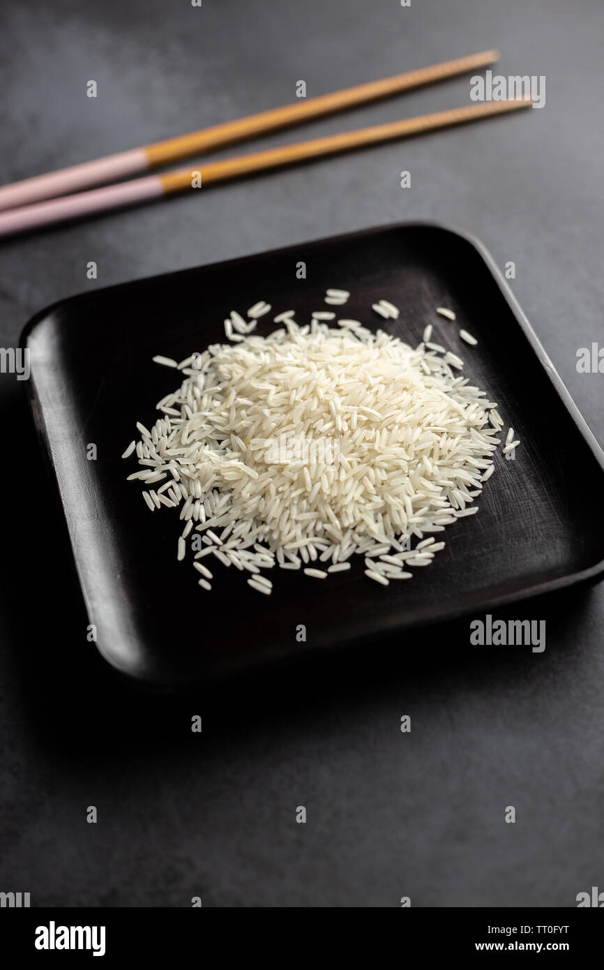 Uncooked rice with chopsticks hi-res stock photography and images - Alamy