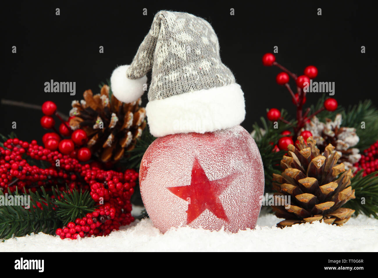 Holiday apple with frosted star in snow on black background Stock Photo ...