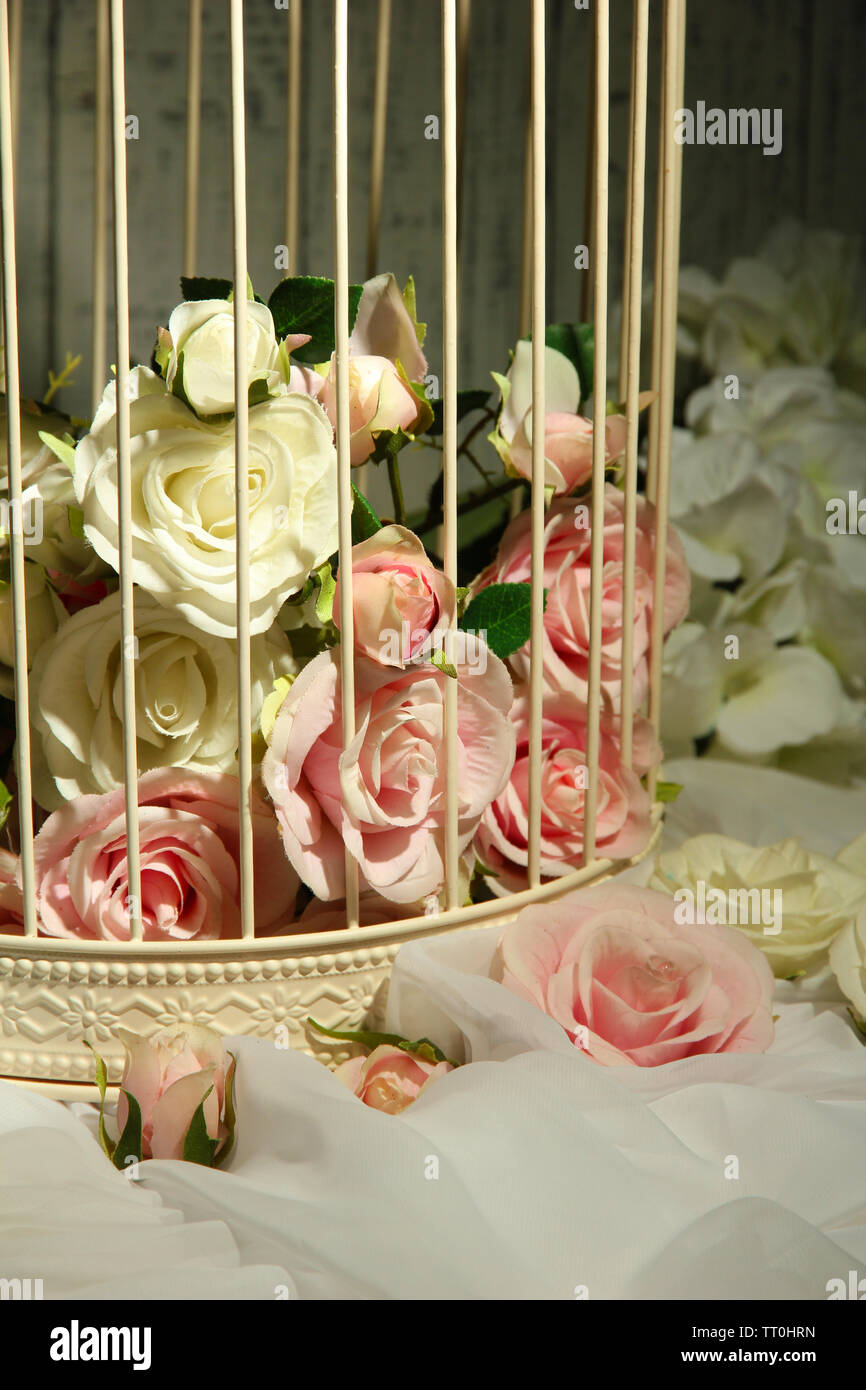 Beautiful decorative cage with beautiful flowers Stock Photo - Alamy
