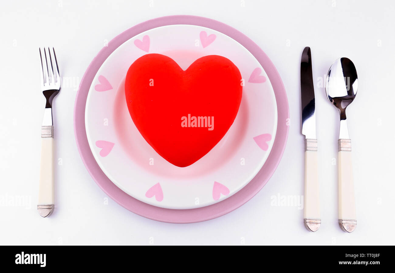 Heart on plate, isolated on white Stock Photo - Alamy