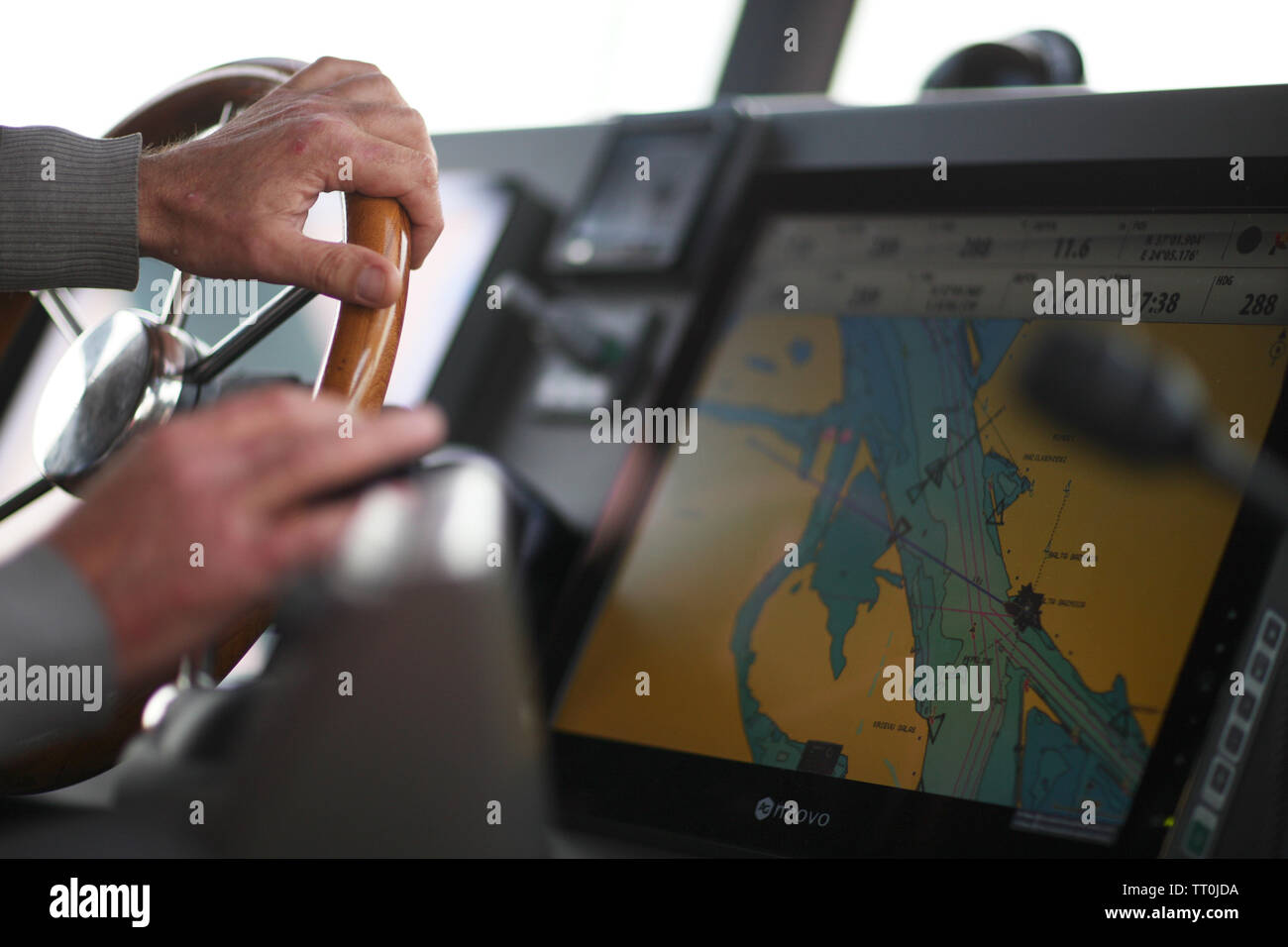 The hands of the captain and a steering wheel boat port services Stock ...