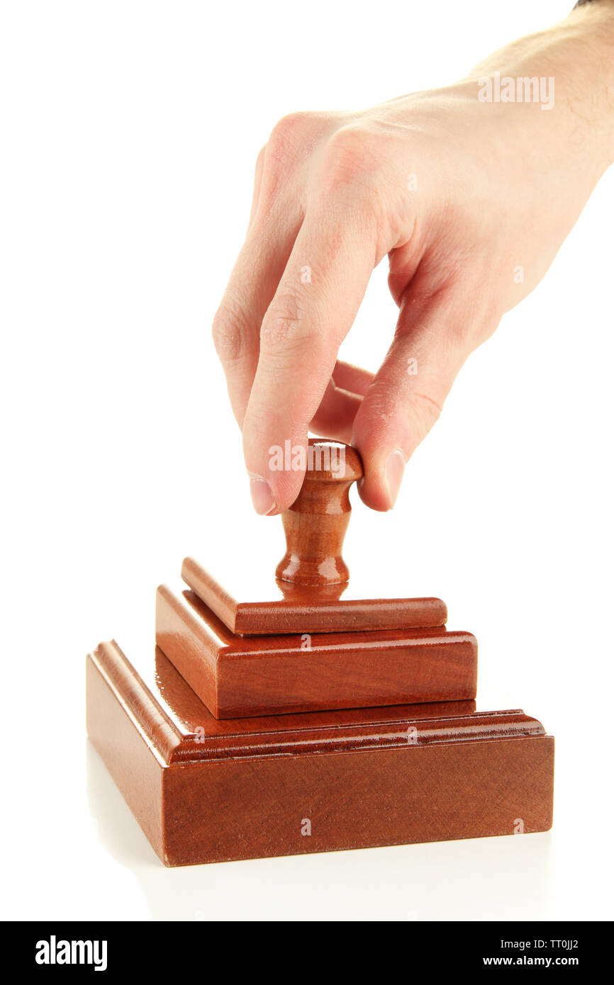 Hand holding wooden stamp isolated on white Stock Photo - Alamy