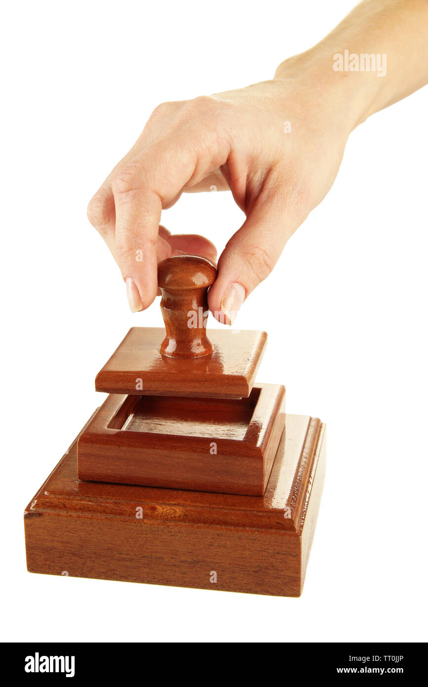 Hand holding wooden stamp isolated on white Stock Photo - Alamy