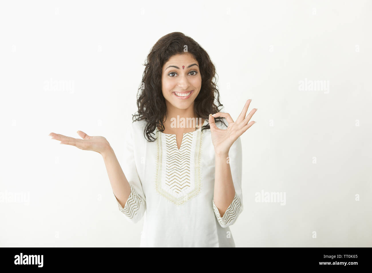 Portrait of a woman gesturing and smiling Stock Photo - Alamy