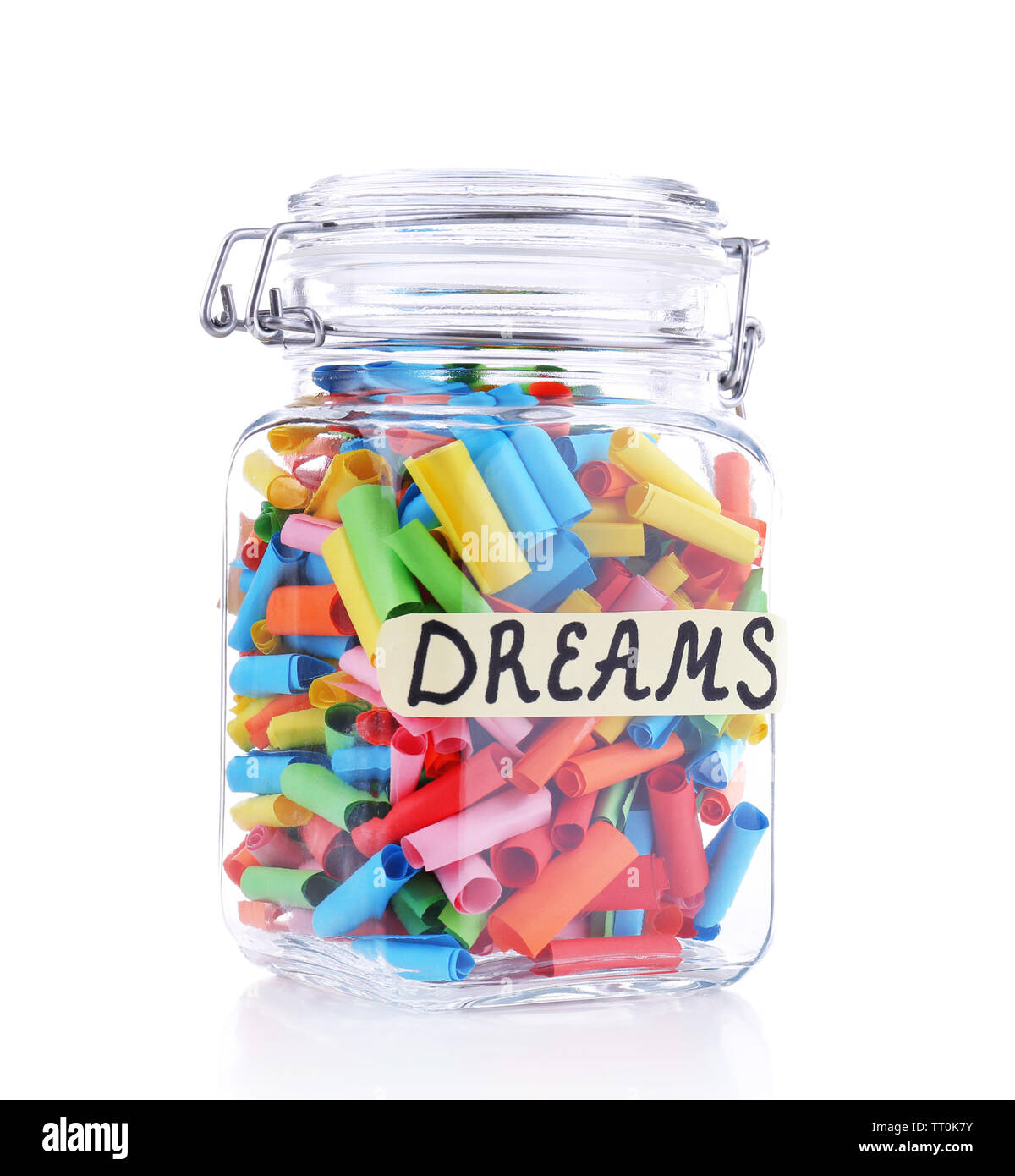 Dreams written on color rolled paper in glass jar, isolated on white ...