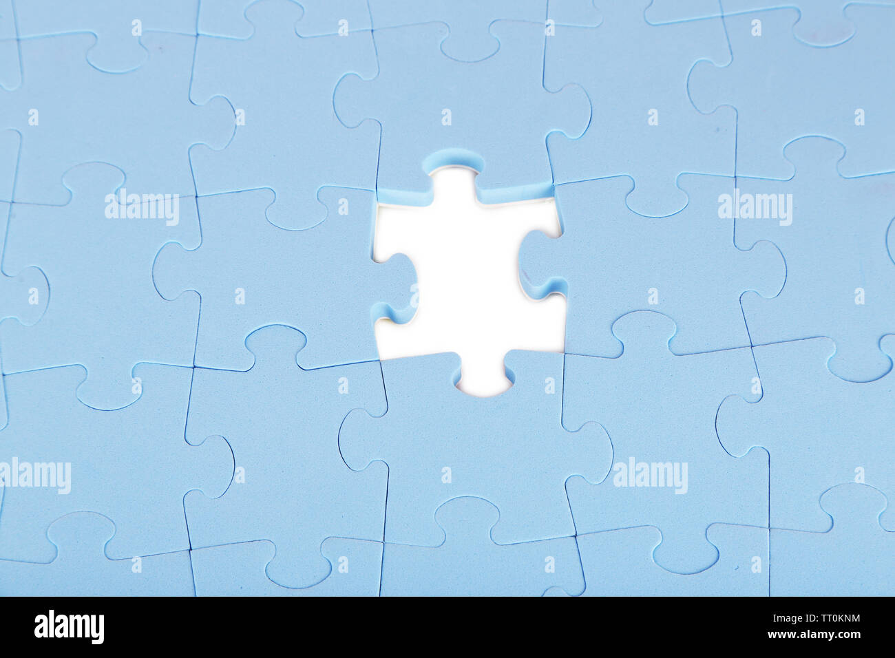 Last piece of jigsaw puzzle, close-up Stock Photo - Alamy