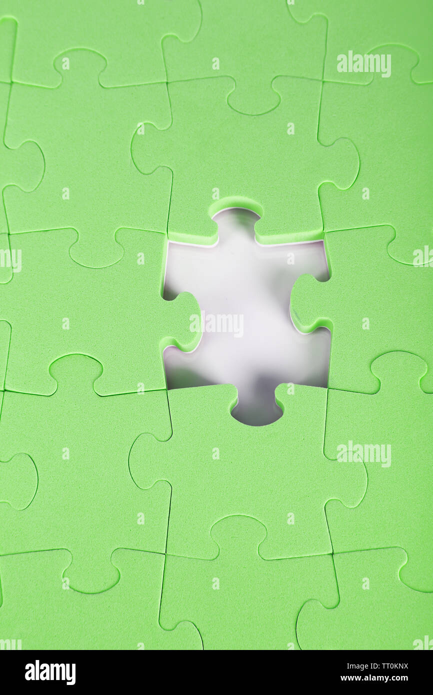 Last piece of jigsaw puzzle, close-up Stock Photo - Alamy