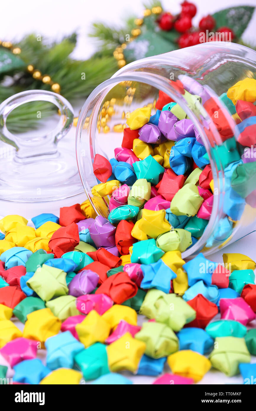 Paper stars with dreams in jar on white background Stock Photo - Alamy