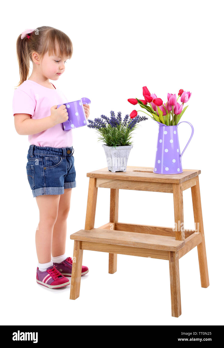 Beautiful little girl and stand with flowers isolated on white Stock ...