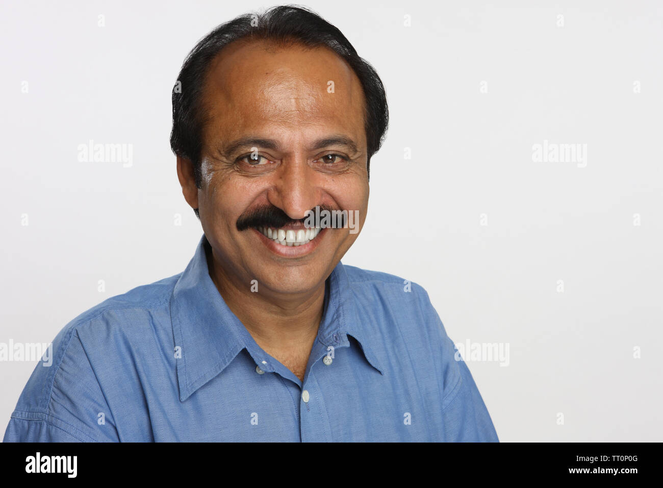 Portrait of an Indian man smiling Stock Photo - Alamy
