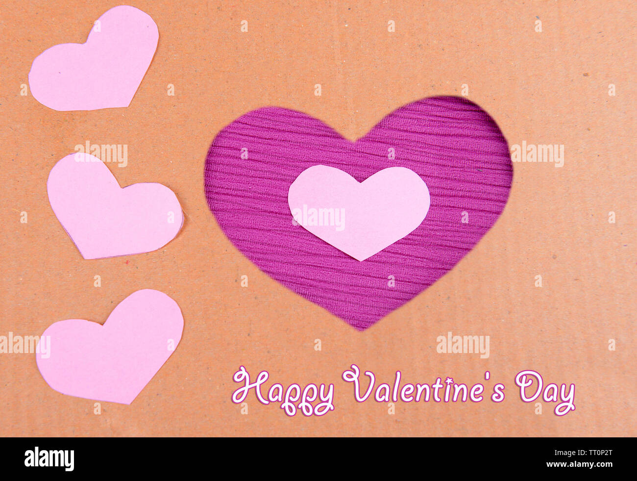 Cardboard heart on purple background Stock Photo - Alamy
