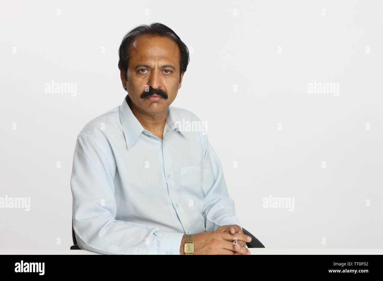 Indian grumpy man serious sulking hi-res stock photography and images ...