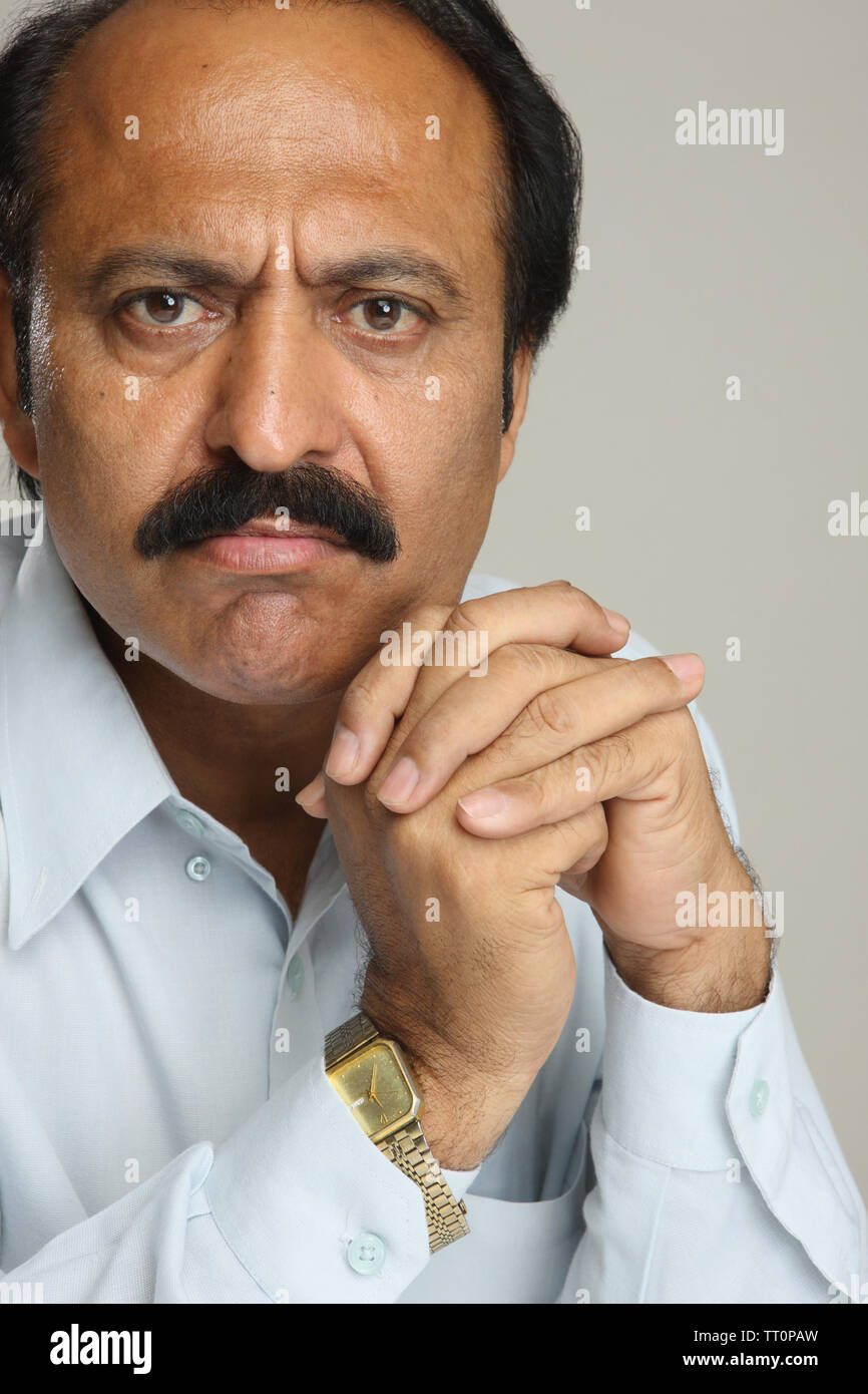 Indian grumpy man serious sulking hi-res stock photography and images ...