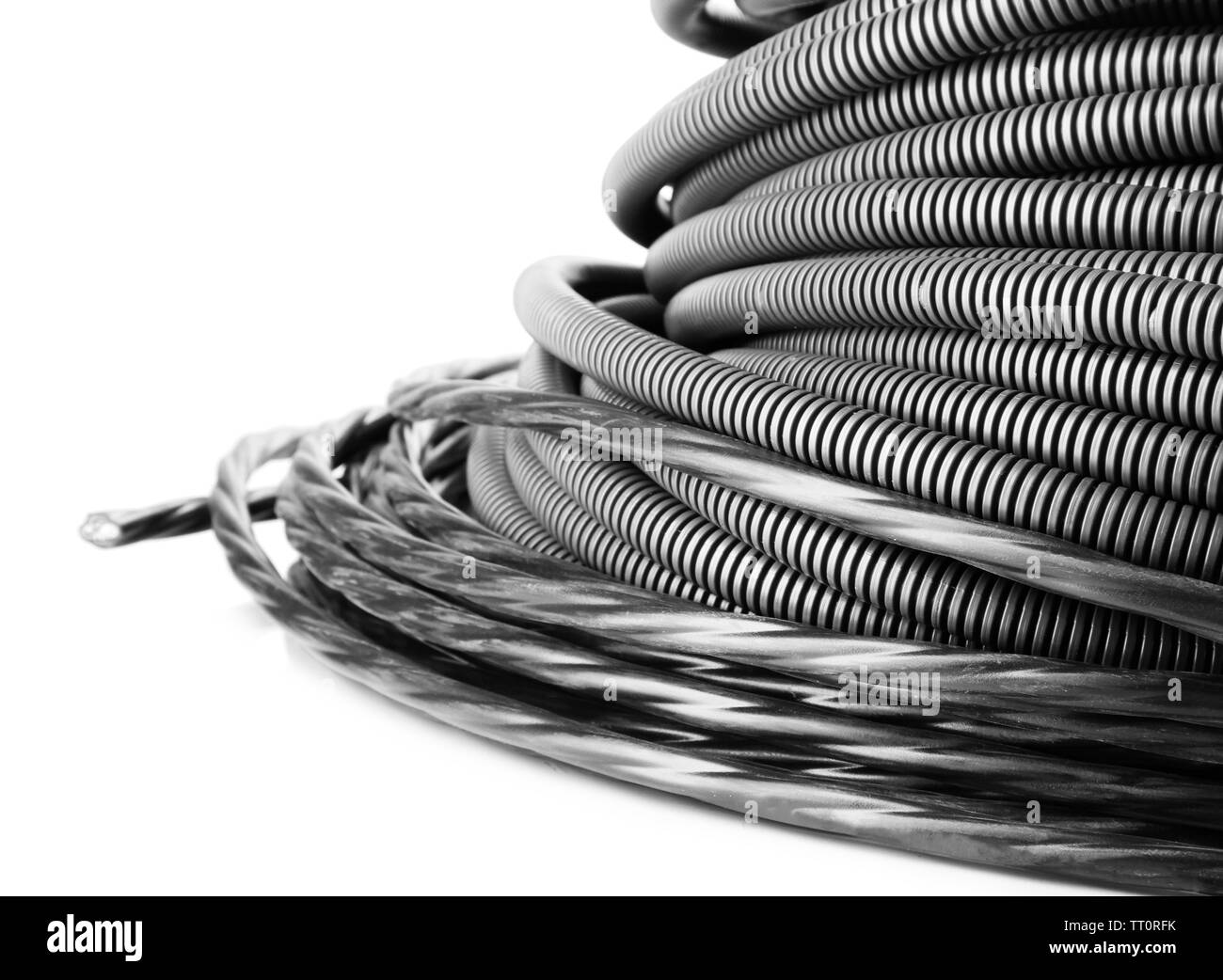 Black cables close-up isolated on white Stock Photo - Alamy