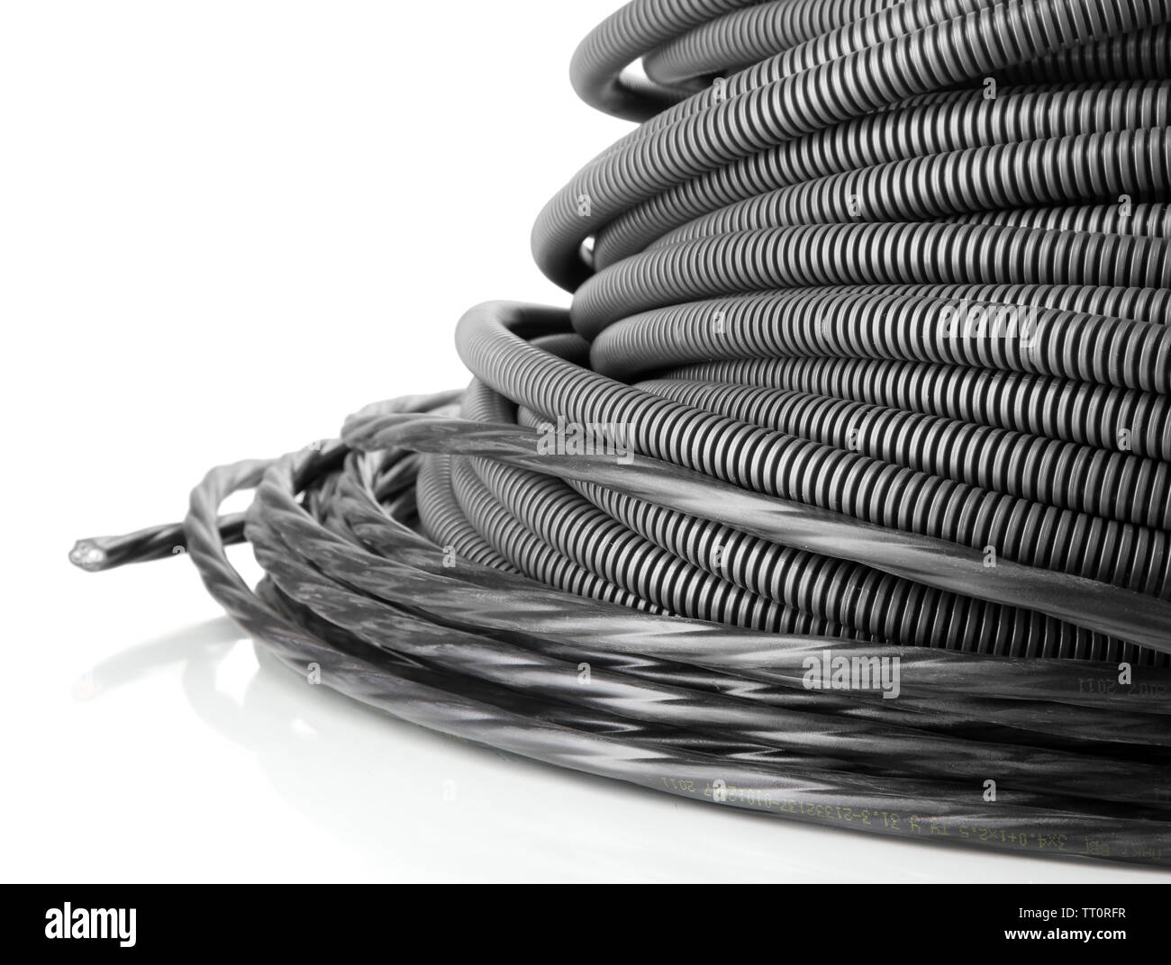 Black cables close-up isolated on white Stock Photo - Alamy
