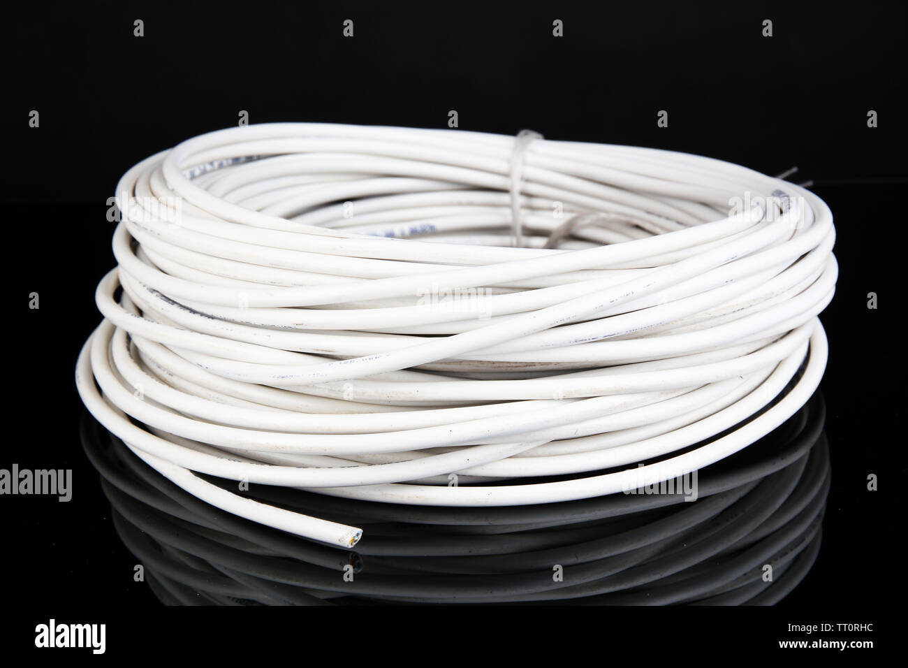 White cable on black background Stock Photo - Alamy