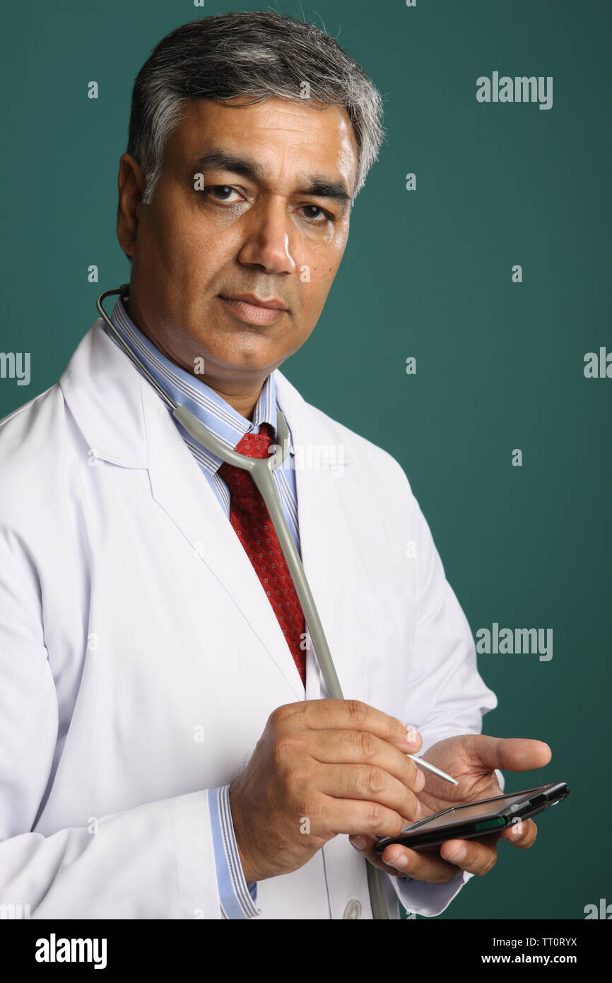 Male doctor using a pda Stock Photo - Alamy